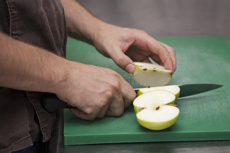 Hands of a Chef Cutting an Apple Stock Photo - Image of cutting ...