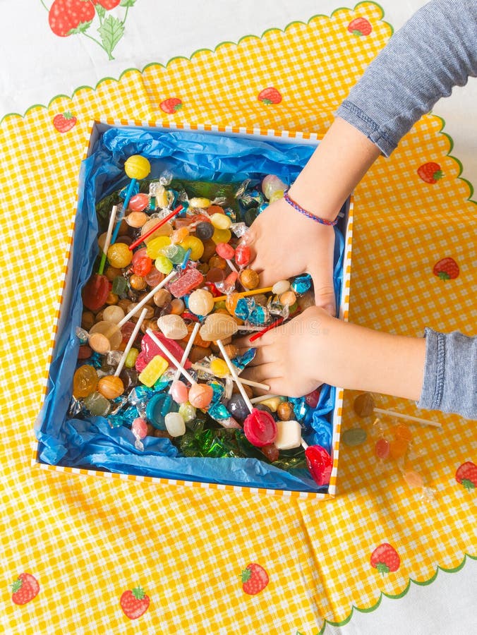 Hands of a Child Inside a Candy Box. Stock Photo - Image of childhood ...