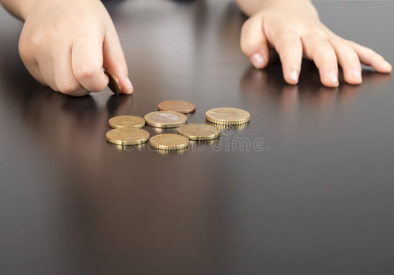 Hands of a Child Picking Up Coins Stock Photo - Image of piggy, indoors ...