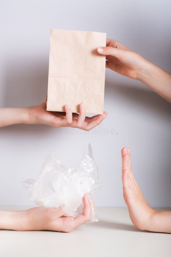 Hands Choose Eco-friendly Paper Bag and Refuse Plastic Bag Vertical ...