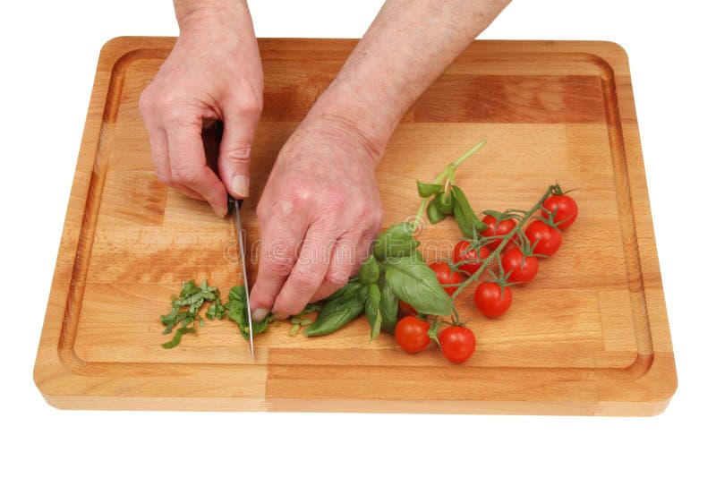 Hands chopping basil stock photo. Image of cooking, wood - 74956202