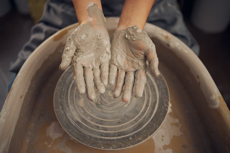 Hands, Clay and Pottery Wheel in a Workshop after Creating a Sculpture ...