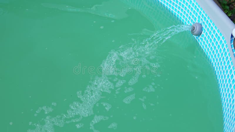 Hands Clean the Pool with Midge, and the Water in the Pool is Cleaned ...