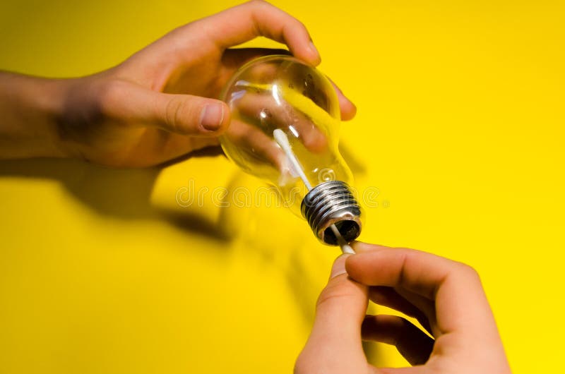 Hands cleaning light bulb stock photo. Image of coin - 155523960