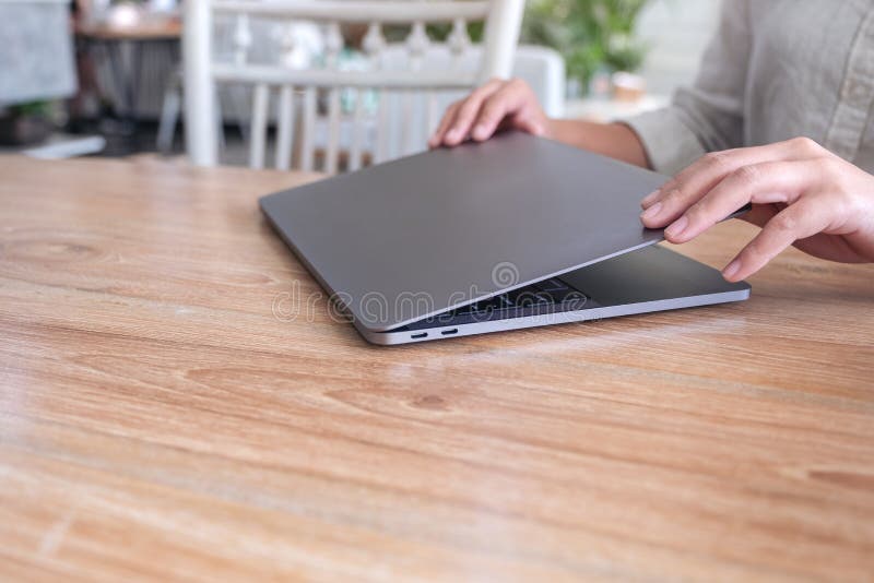 Hands Close and Open a Laptop Computer on Table after Finished Using it ...