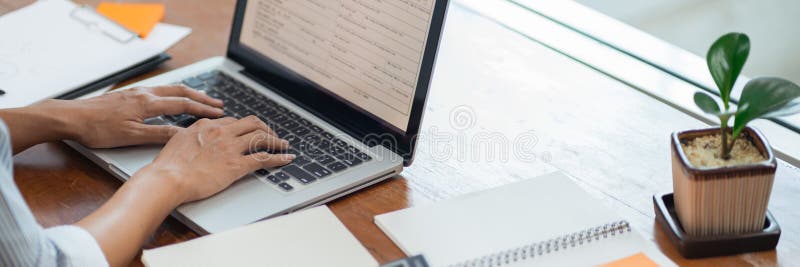 Hands Close Up Freelancer Busy Working on a Laptop Computer on Desktop ...