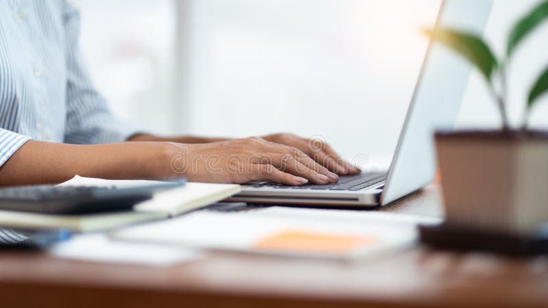 Hands Close Up Freelancer Busy Working on a Laptop Computer on Desktop ...