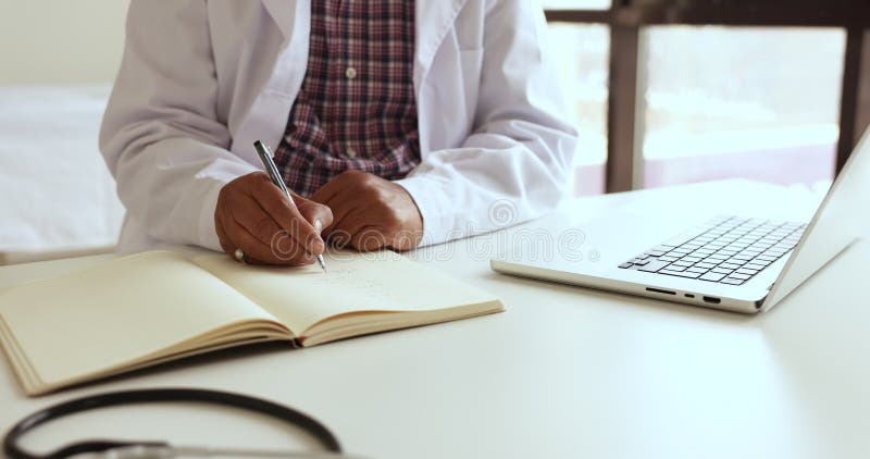 Close Up of Senior Doctor Man Writing Records in Notebook Stock Footage ...