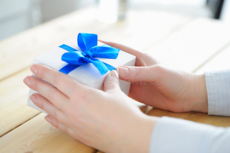 Hands Closeup. Gift with Blue Ribbon in Hands. Stock Image - Image of ...