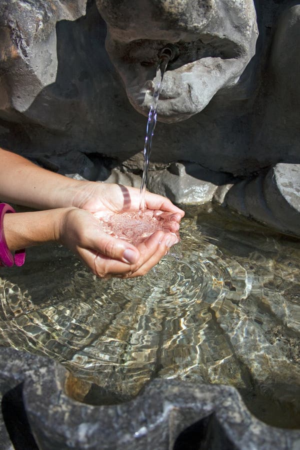 Hands Collecting Water from Fountain Stock Photo - Image of pickup ...