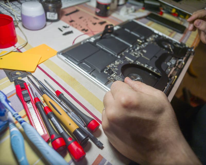 Fixing broken laptop stock image. Image of specialist - 235952383