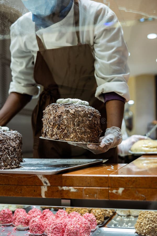 A Hands of Confectioner-chocolatier during at Work. the Making of Cake ...