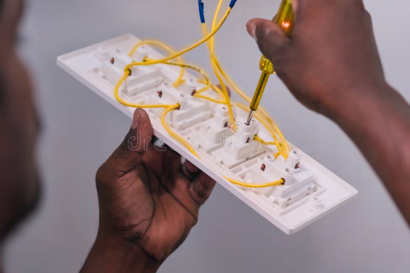 Installing Outlets with Yellow Wiring Stock Image - Image of ...