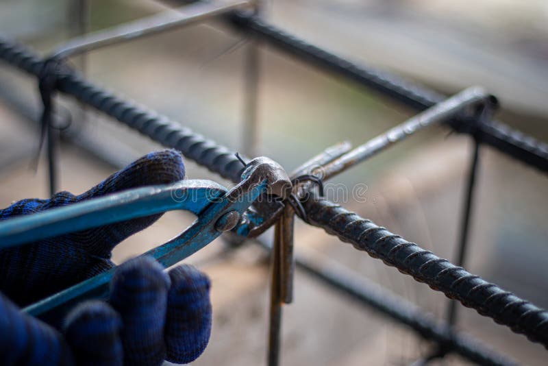 The Hands of Construction Workers Using Steel Wire To Bind Steel Bars ...