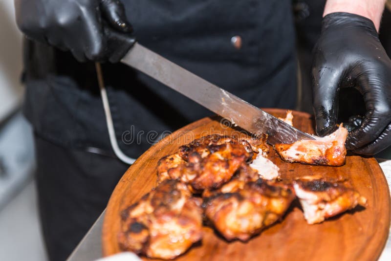 Hands cook cut fried meat stock photo. Image of calf - 113522552