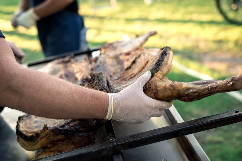 The Hands of the Cook Cut the Greased Carcass of the Rabbit Stock Photo ...