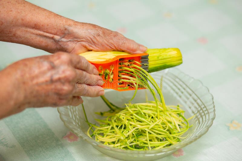 Hands of a Cook Grating a Zucchini. Stock Image - Image of grate, bowl ...
