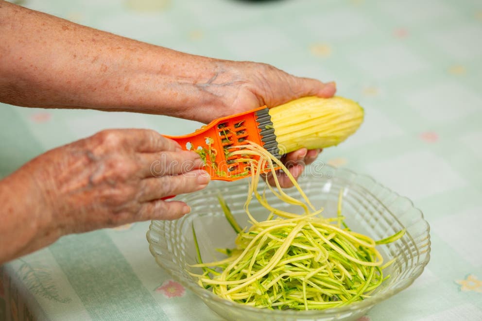Hands of a Cook Grating a Zucchini. Stock Image - Image of food ...