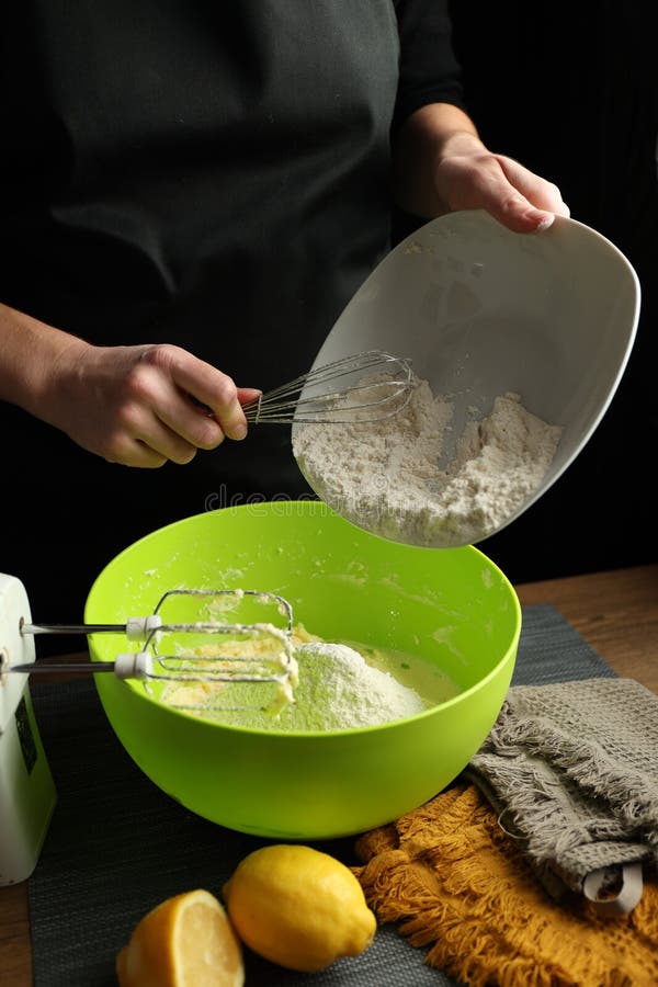 The Hands of the Cook Pour the Flour into the Bowl, Preparing the Dough ...