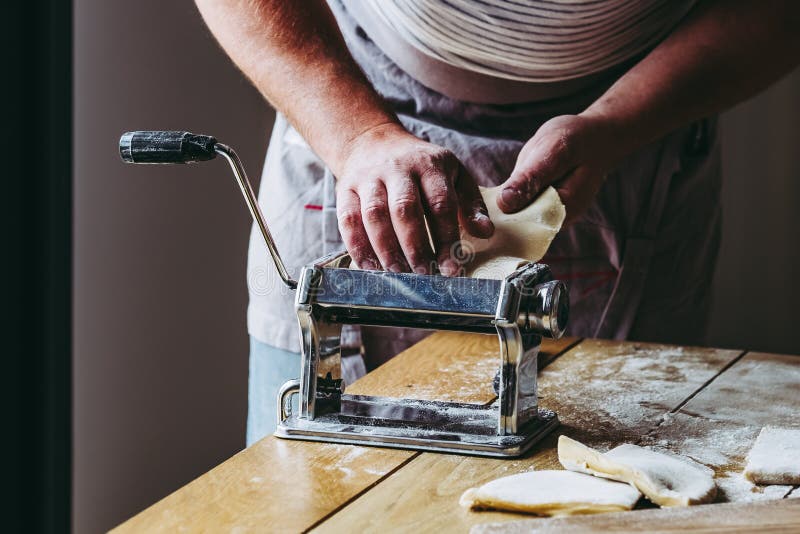 Hands of a Cook Preparing Fresh Pasta at the Rolling Mill Stock Image ...