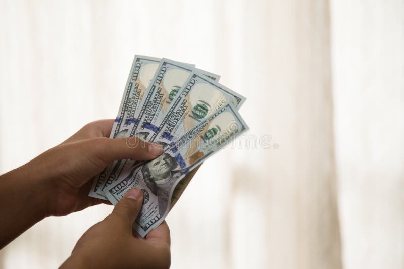 Hands counting dollars. stock image. Image of finance - 51169191