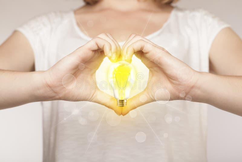 Hands Creating a Form with Light Bulb Stock Photo - Image of ...