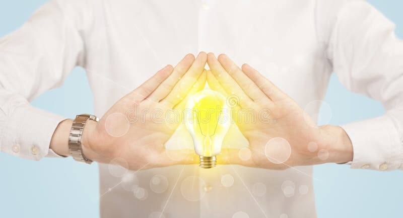 Hands Creating a Form with Light Bulb Stock Photo - Image of great ...