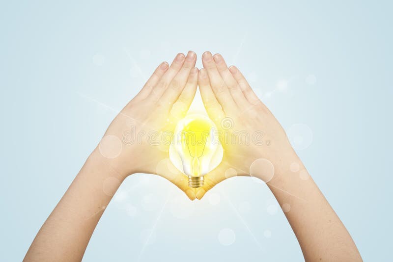 Hands Creating a Form with Light Bulb Stock Photo - Image of bulb ...