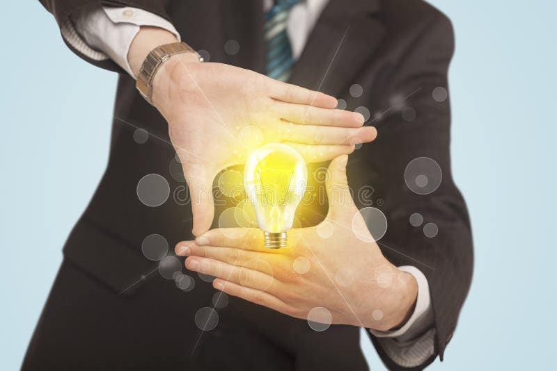 Hands Creating a Form with Light Bulb Stock Photo - Image of brain ...