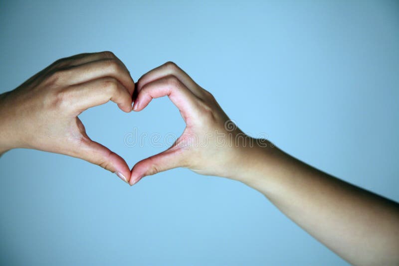 Hands creating heart shape stock photo. Image of fingertips - 6850048
