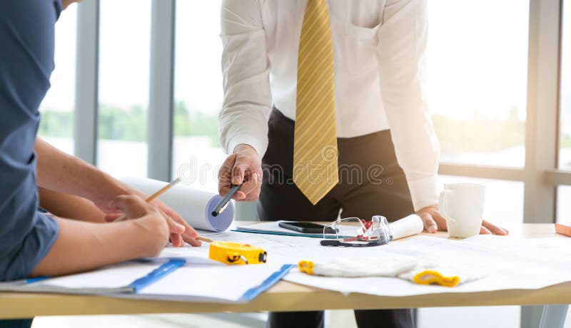 Hands of Creative Team Discussing Plan a Blueprint of the Building ...