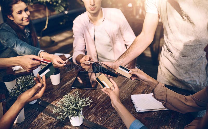 Hands, Credit Card and Friends at Cafe for Payment, Online Transaction ... Hands, Credit Card and Friends at Cafe for Payment, Online Transaction ...
