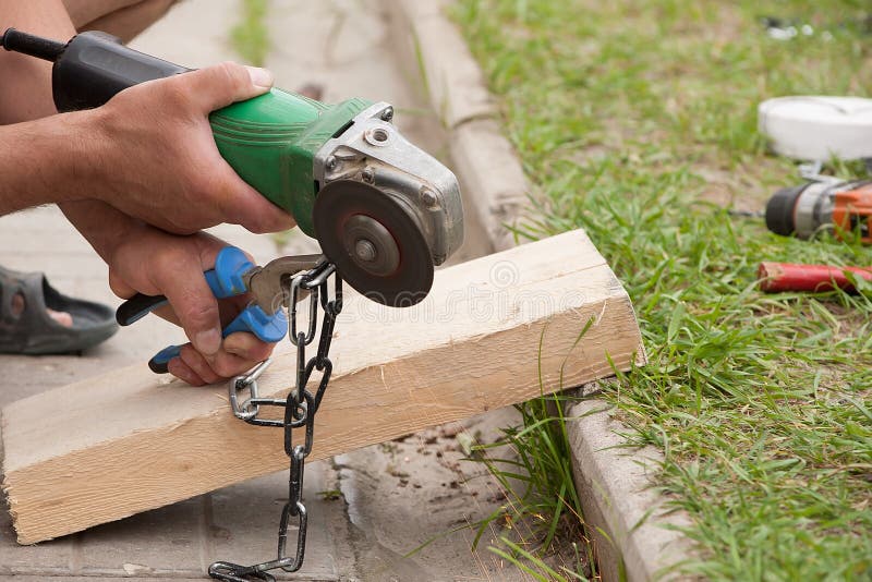 Hands Cut the Chain with a Grinder Stock Photo - Image of equipment ...