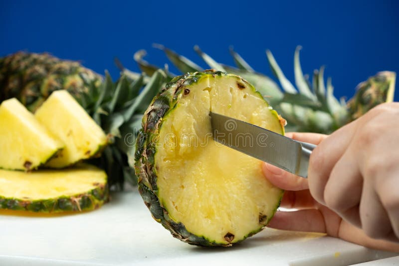 Hands Cutting Fresh Pineapple Fruit into Pieces. Stock Image - Image of ...