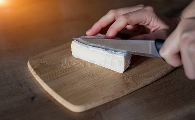 Hands Cutting of Freshly Unwrapped Cheese Stock Photo - Image of meal ...