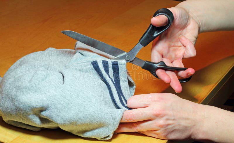 Hands Cutting Material with Shears or Scissors. Stock Photo - Image of ...