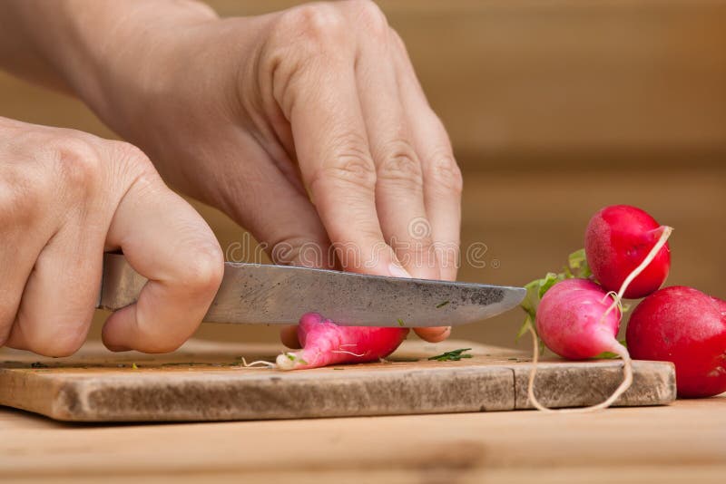 Hands Cutting Radishes on the Chopping Board Stock Photo - Image of ...