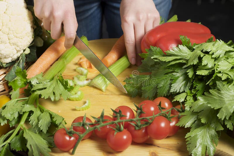 Hands cutting vegetables stock image. Image of food, human - 12941969