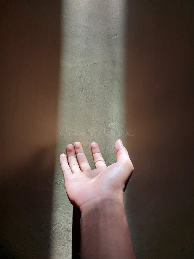 Hands in the Dark Pleading, and Shining in the Sun Stock Image - Image ...