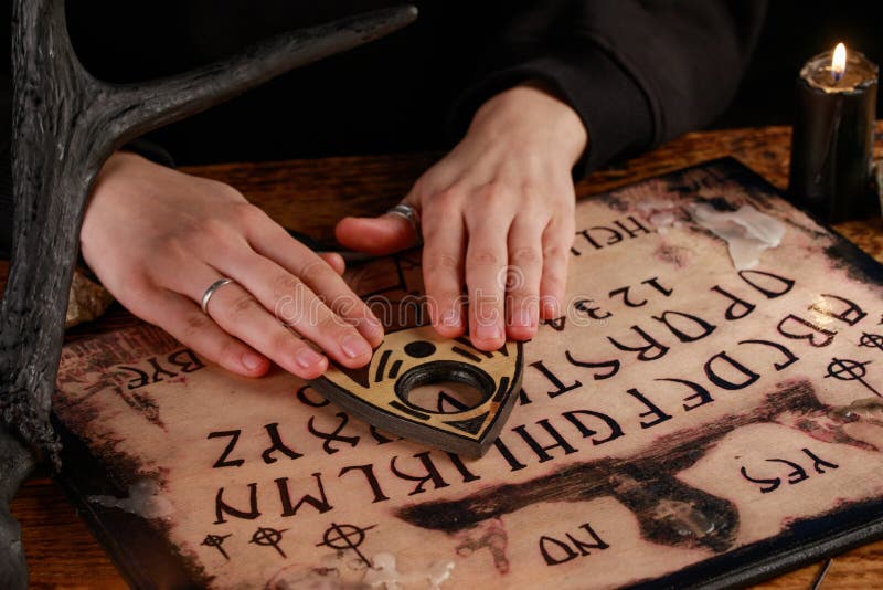 Hands on the Devil`s Board. Session of Calling Spirits Stock Image ...