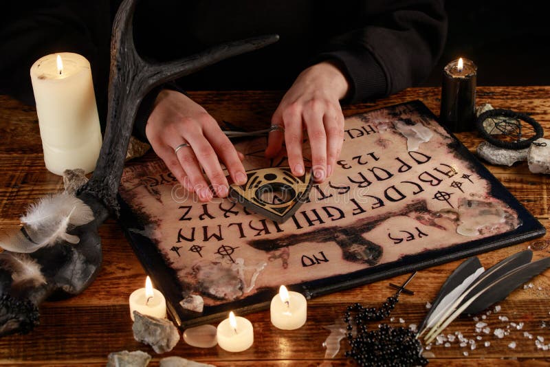 Hands on the Devil`s Board. Session of Calling Spirits Stock Image ...