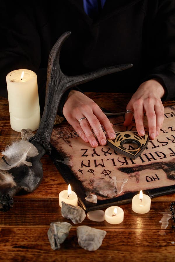 Hands on the Devil`s Board. Session of Calling Spirits Stock Image ...