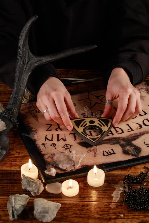 Hands on the Devil`s Board. Session of Calling Spirits Stock Image ...