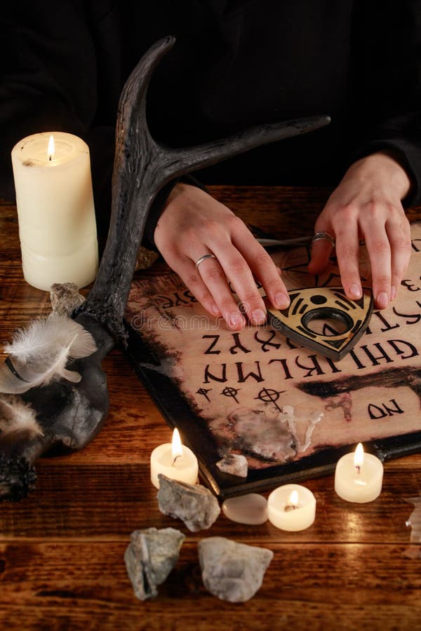 Hands on the Devil`s Board. Session of Calling Spirits Stock Photo ...