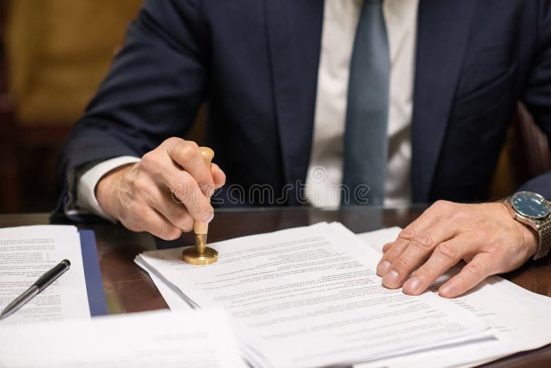 Hands of Director in Elegant Suit Putting Stamp on Approved Document ...