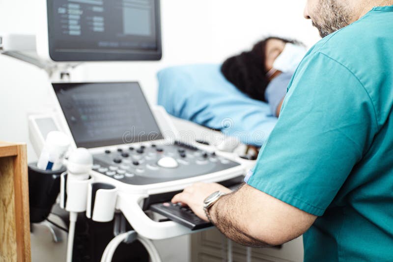 Hands of a Doctor Using an Ultrasound Machine. Stock Photo - Image of ...