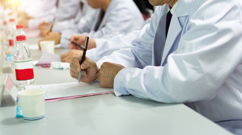 Doctors Writing at Conference Stock Image - Image of conference, person ...