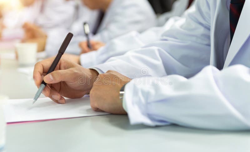 Doctors Writing at Conference Stock Photo - Image of ballpoint, clinic ...