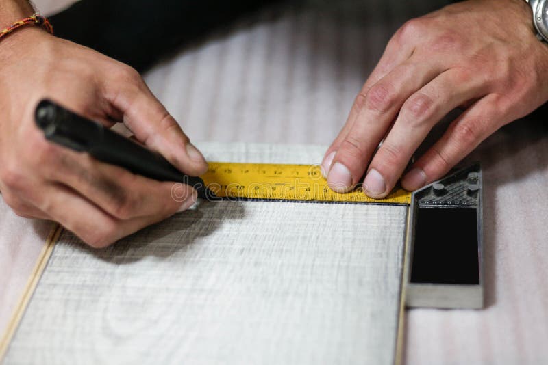 Hands Draw Marker on the Ruler. Laying Laminate Stock Photo - Image of ...