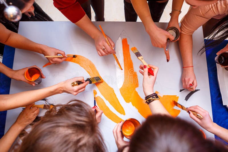 Hands Draw on the Poster, the Concept of Teamwork Stock Photo - Image ...